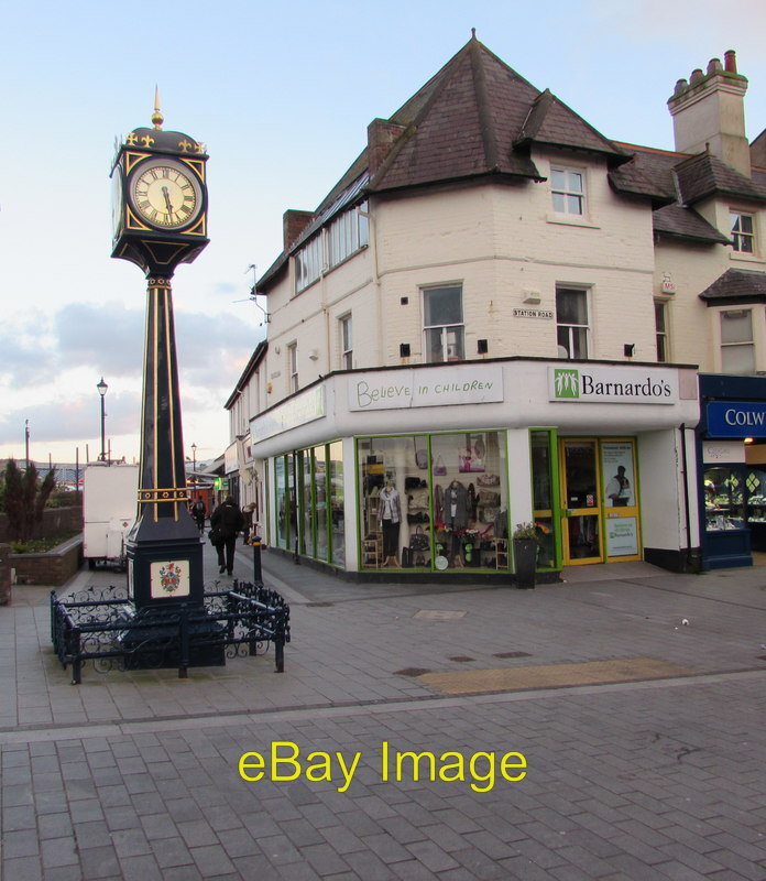 Photo 6x4 Town centre clock tower and Barnardo's charity shop, Colwyn ...