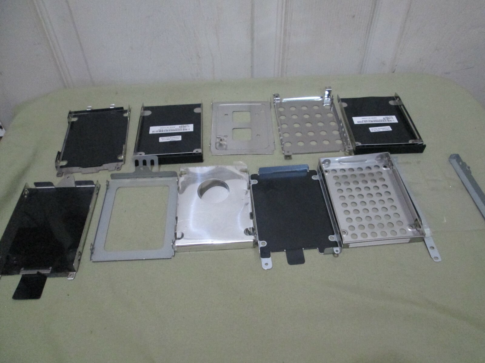 Large lot of desktop and laptop hard drive rails and caddies. See ...