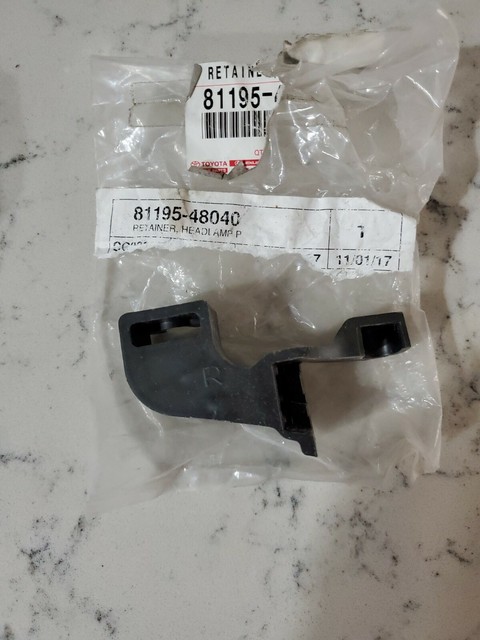 8119548040 Genuine Toyota Retainer Headlamp Protector LWR RH 81195 ...