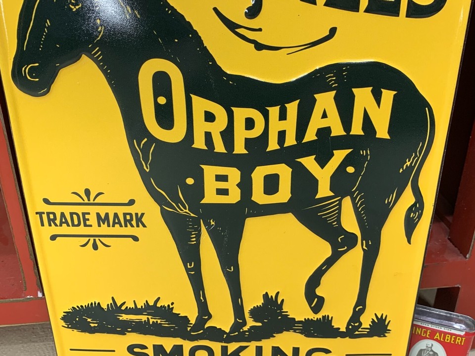 "ORPHAN BOY SMOKING TOBACCO" EMBOSSED METAL ADVERTISING SIGN, (20"x 14 ...