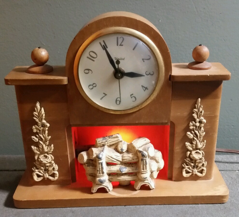 UNITED CLOCK FIREPLACE MANTLE OR SHELF CLOCK W/ FLICKERING RED BULB ...