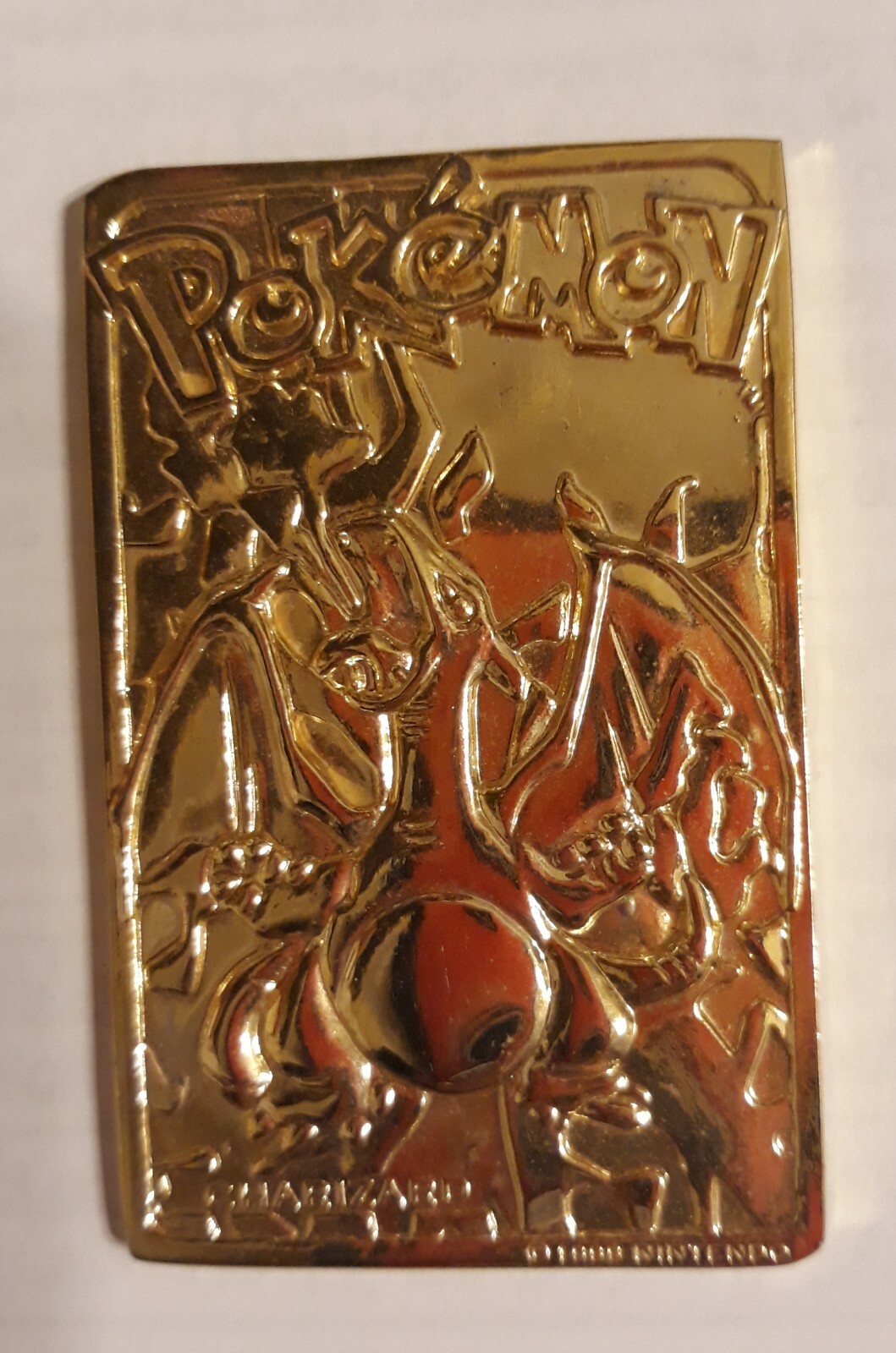 pokemon gold plated card the character is Charizard in mint condition ...