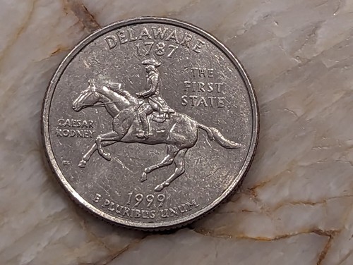 1999 D - Delaware Statehood Quarter Dollar Coin. Featuring Caesar ...