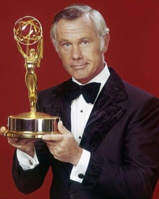 Johnny Carson in tuxedo holding Emmy Award statue 16x20 inch poster | eBay