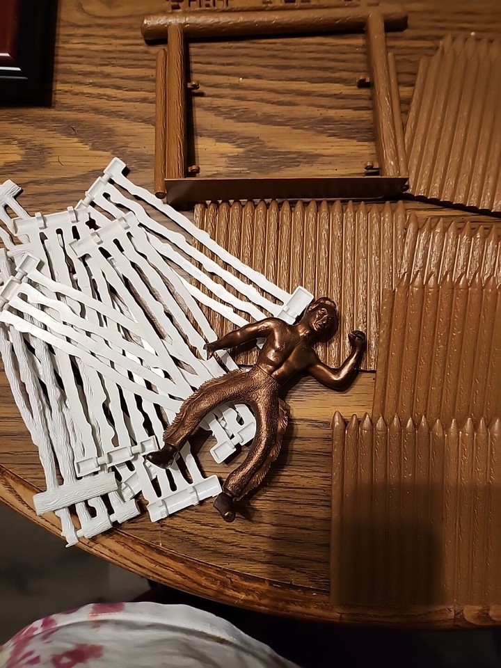 Fort Apache Gate And Log Fence, With White Fencing And An Indian Figure ...