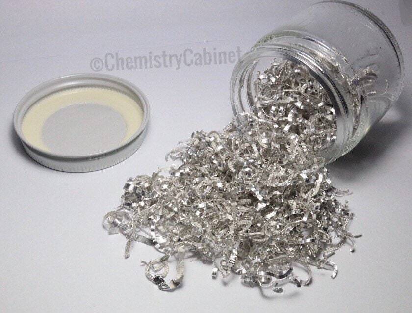 Jar of magnesium metal turnings 99.95% pure element 12 mg chemistry ...