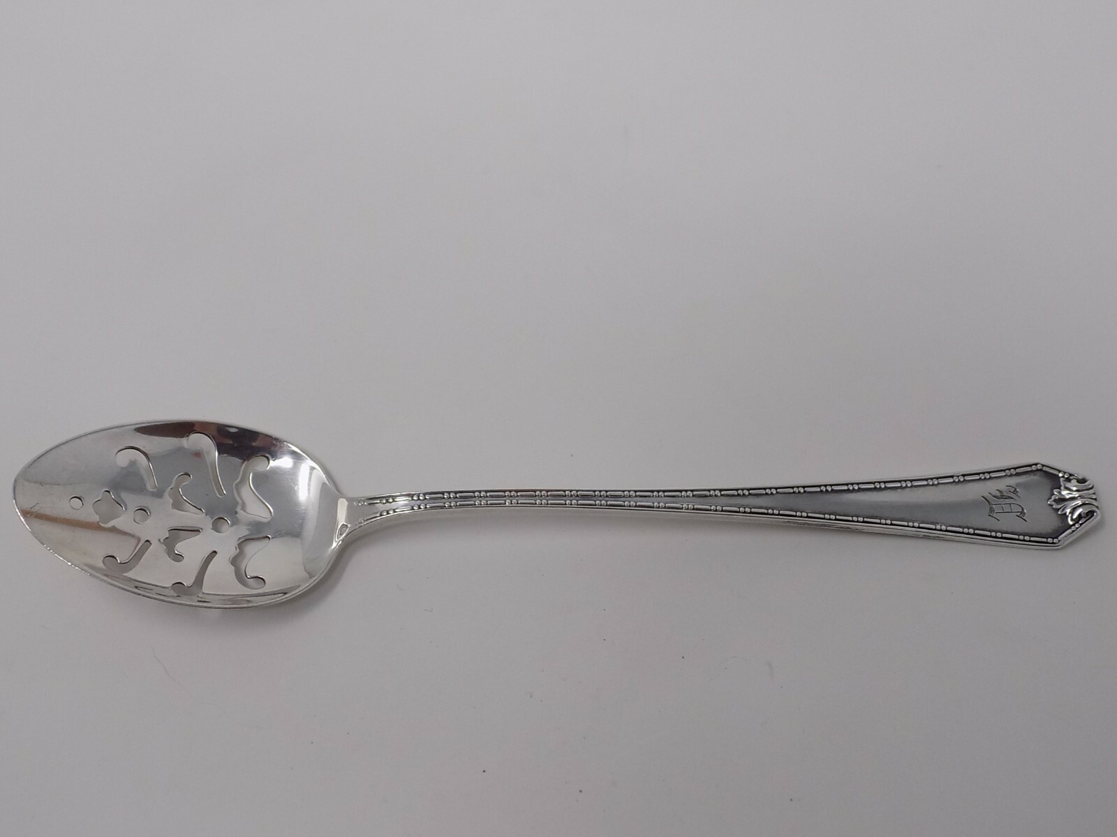 A STOWELL & CO. STERLING SILVER PIERCED OLIVE SOUP SPOON 6 1/8 PAT 1910 ...