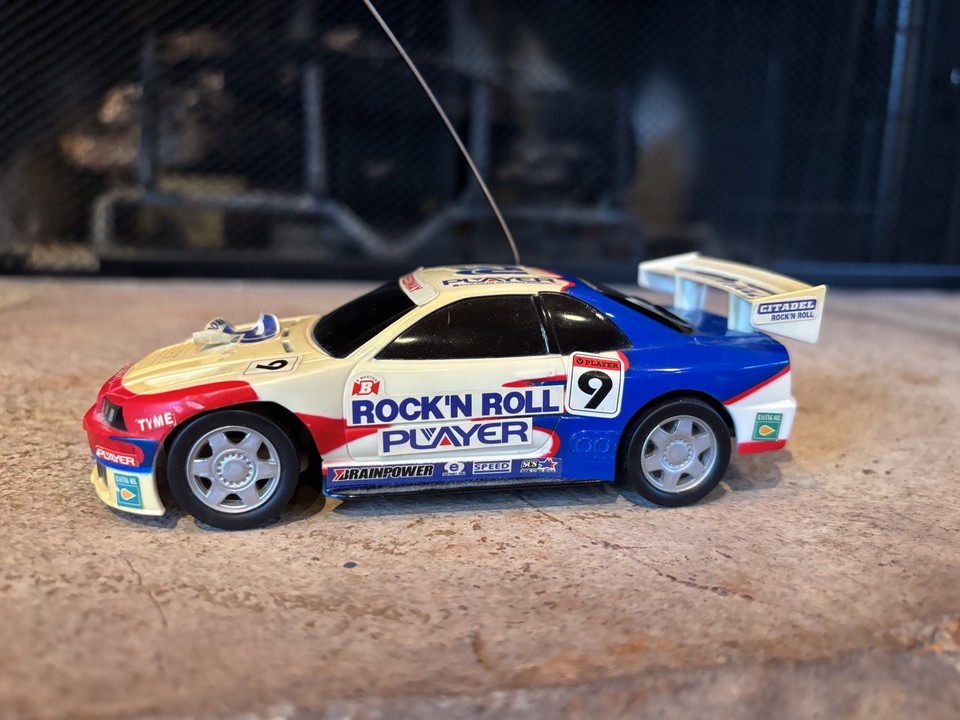 Vintage AULDEY Remote Control Car Nissan GT-R R34 2001 ROCK N ROLL 1:32 ...
