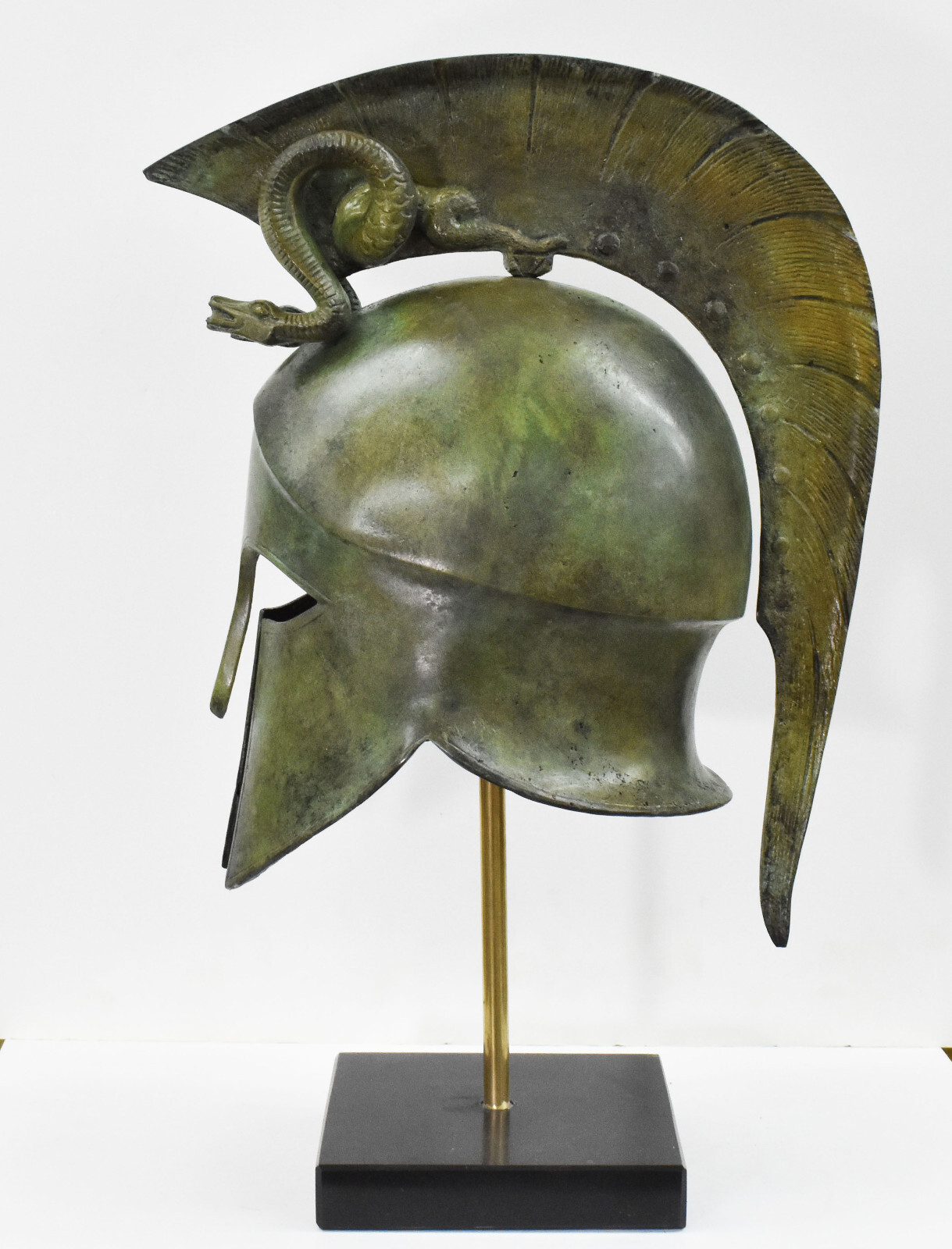 Corinthian bronze helmet with snakes on marble base - Hoplite soldier ...