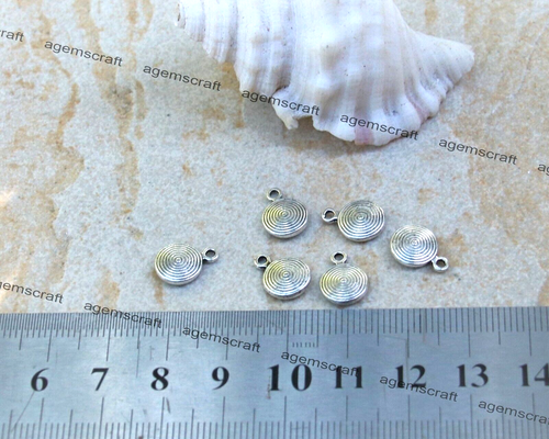 18 small Round 11x8mm spiral, circles textured coin silver tone charms ...