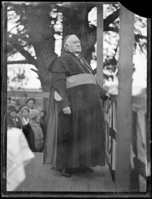 Archbishop Michael Kelly standing on a verandah before a crowd, NS ...