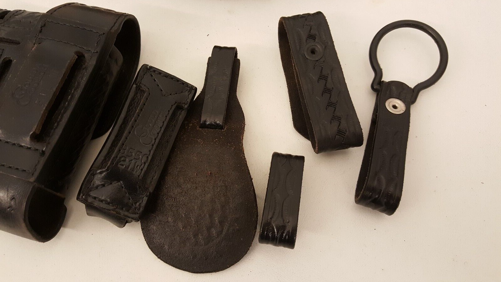 9 pc lot of Gould Goodrich leather holders dual mag handcuff mag light ...