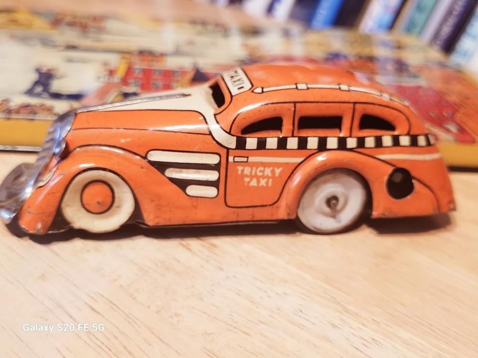 VINTAGE 1930'S MARX TIN LITHO ORANGE WIND UP TRICKY TAXI with TIN BUSY ...