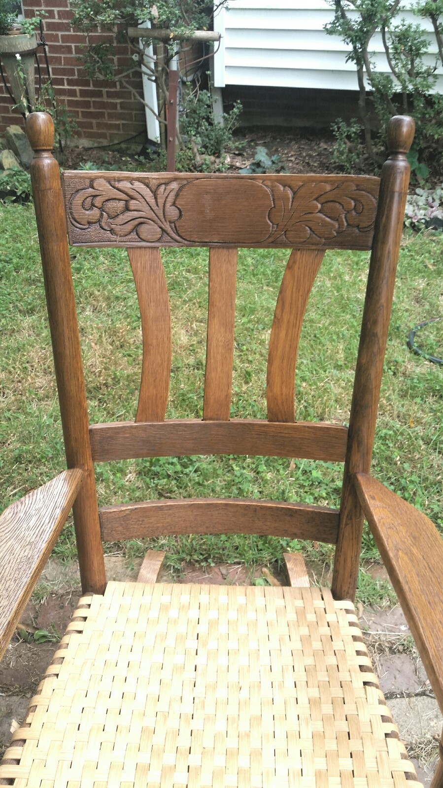 Woven splint seat oak rocker with pressed leaf & flower design on the ...