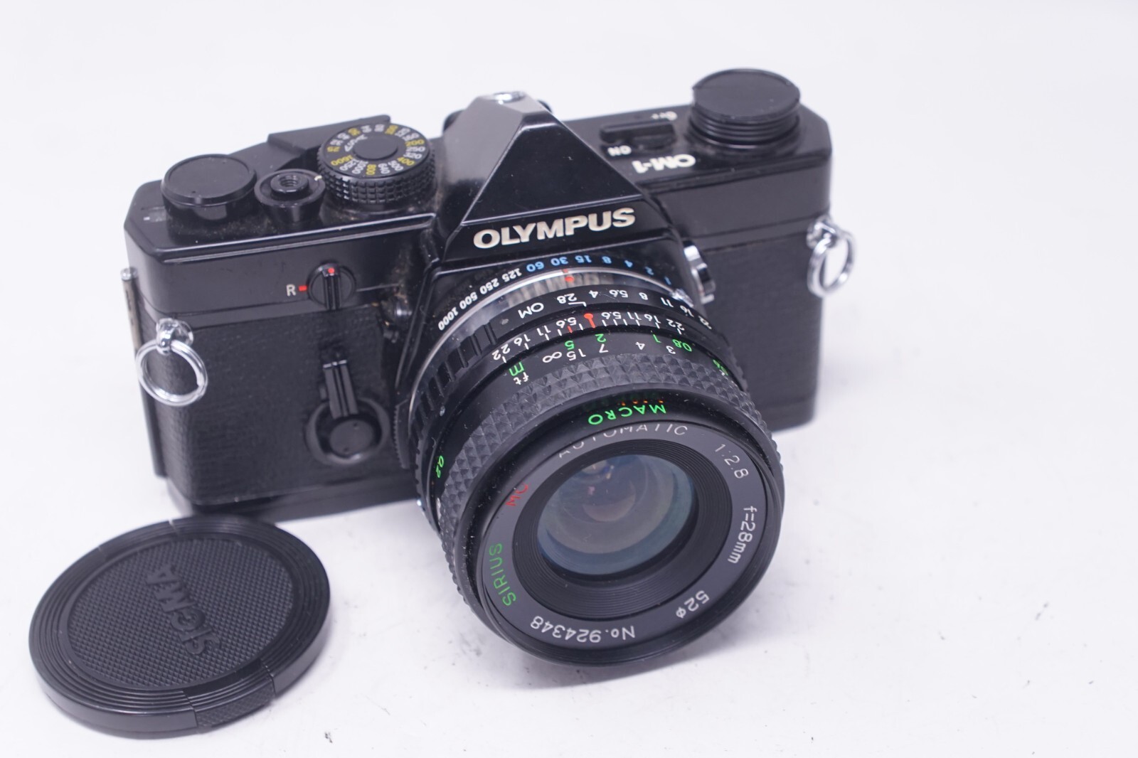 Olympus OM1 N 35mm SLR Film Camera with Sirius 28mm prime lens (black ...