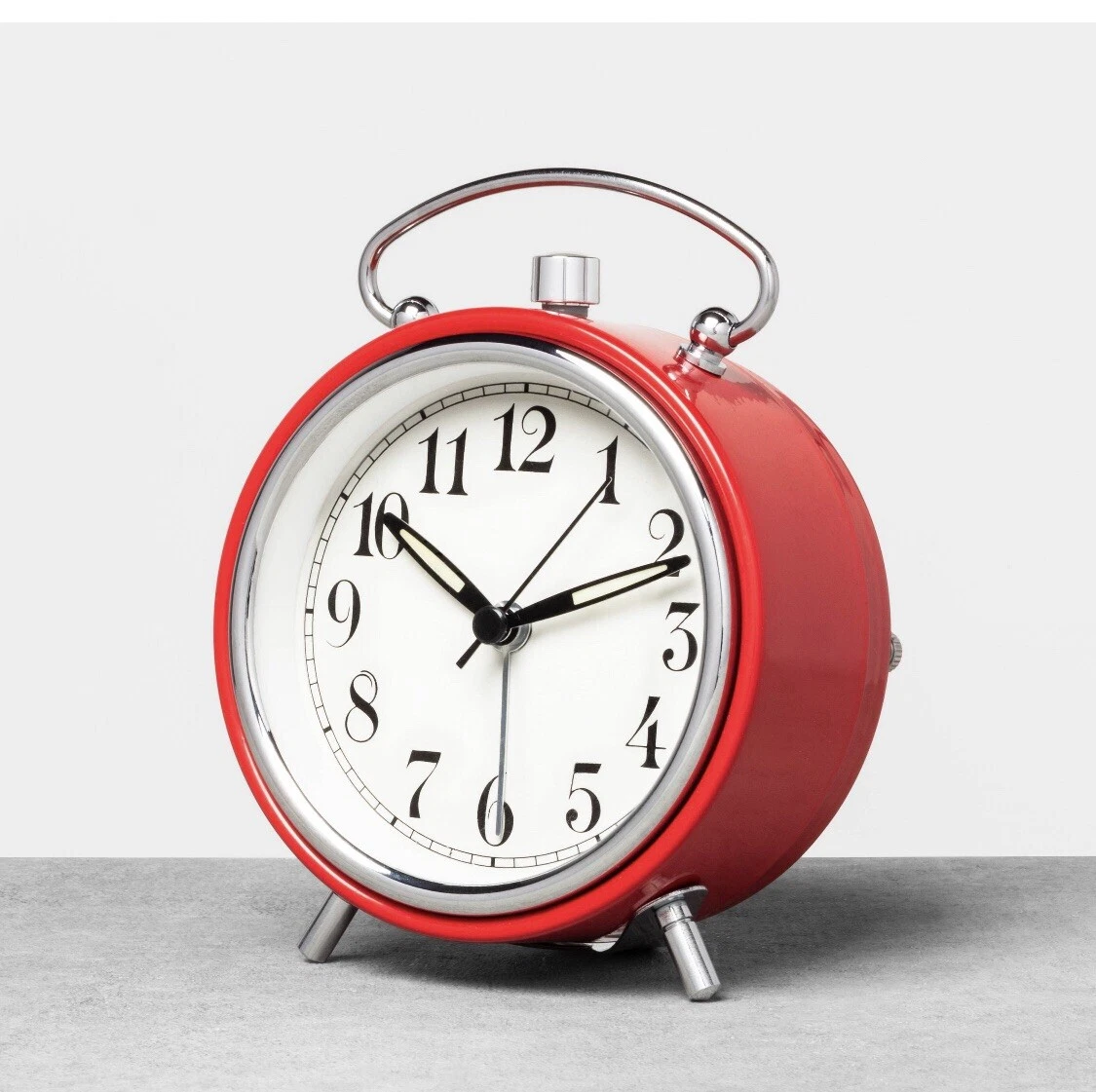 Red Alarm Clock In Hand Holding