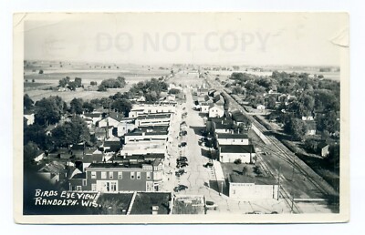 Randolph WI, aerial view, cars, street, railroad tracks, 1951 RPPC ...