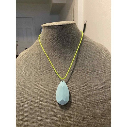 Pretty Upcycled teal blue teardrop pendant necklace on bright green ...