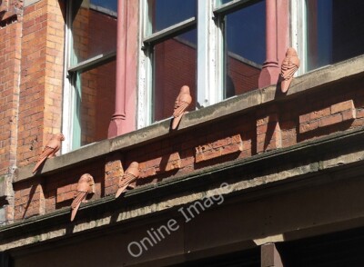 Photo 6x4 Detail of 70 Tib Street, Manchester Five carved parrots ...