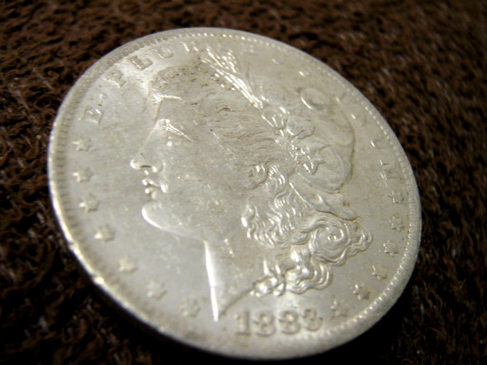 1883 O Morgan silver dollar, AU condition++ (New Orleans) shows crisp ...