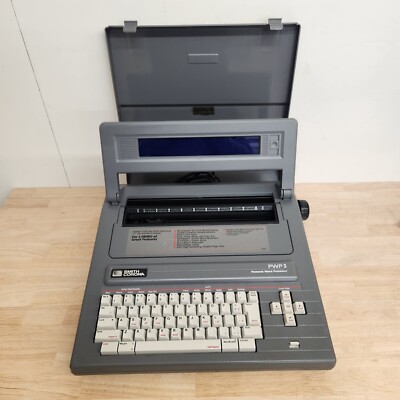 Typewriters & Word Processors - Portable Word Processor Writing