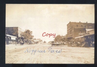 REAL PHOTO HIGGINS TEXAS DOWNTOWN DIRT STREET SCENE POSTCARD COPY ...