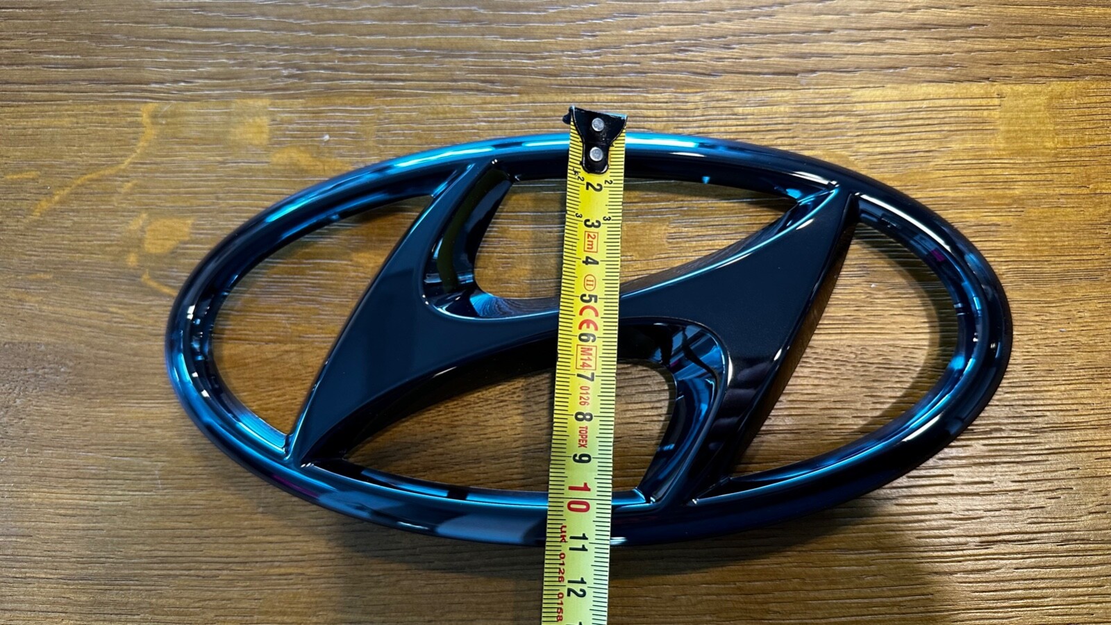 GENUINE HYUNDAI TUCSON NX4 2020- FRONT GRILLE BADGE 86300-N9010 | eBay