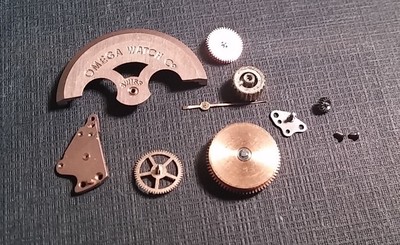 Omega 683 lot of watch parts. hand. screws. 3.85mm yellow crown. rotor ...