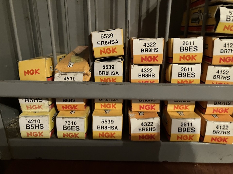 Over 140 new NGK spark plugs in display rack. | eBay UK