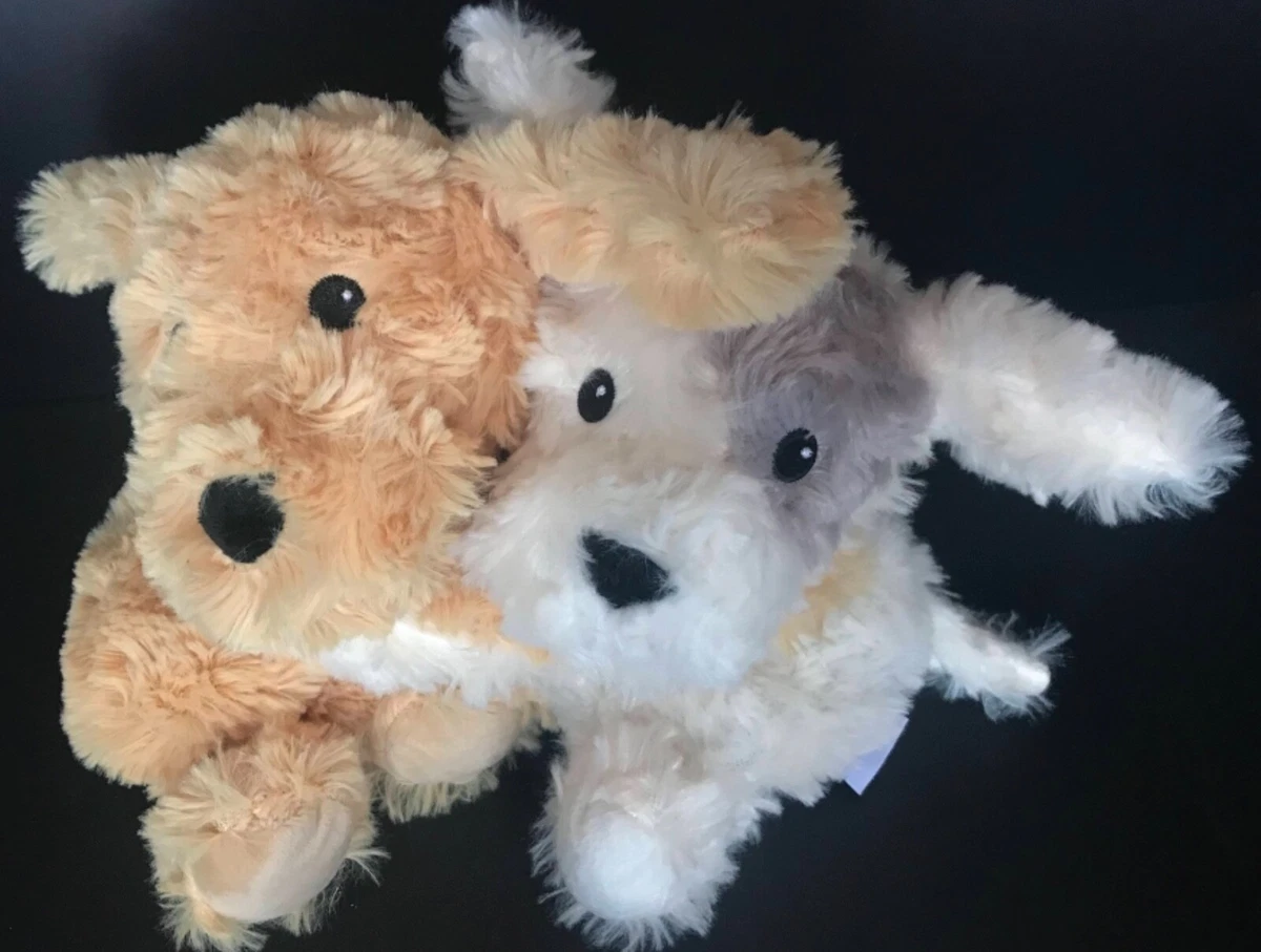 Puppies Cuddling With Stuffed Animals