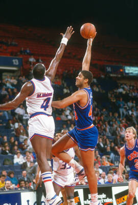 Brad Daugherty Cleveland Cavaliers shoots over Moses Malon- Basketball ...