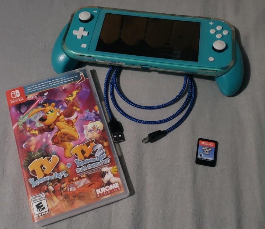 Used nintendo switch lite bundle with games | eBay