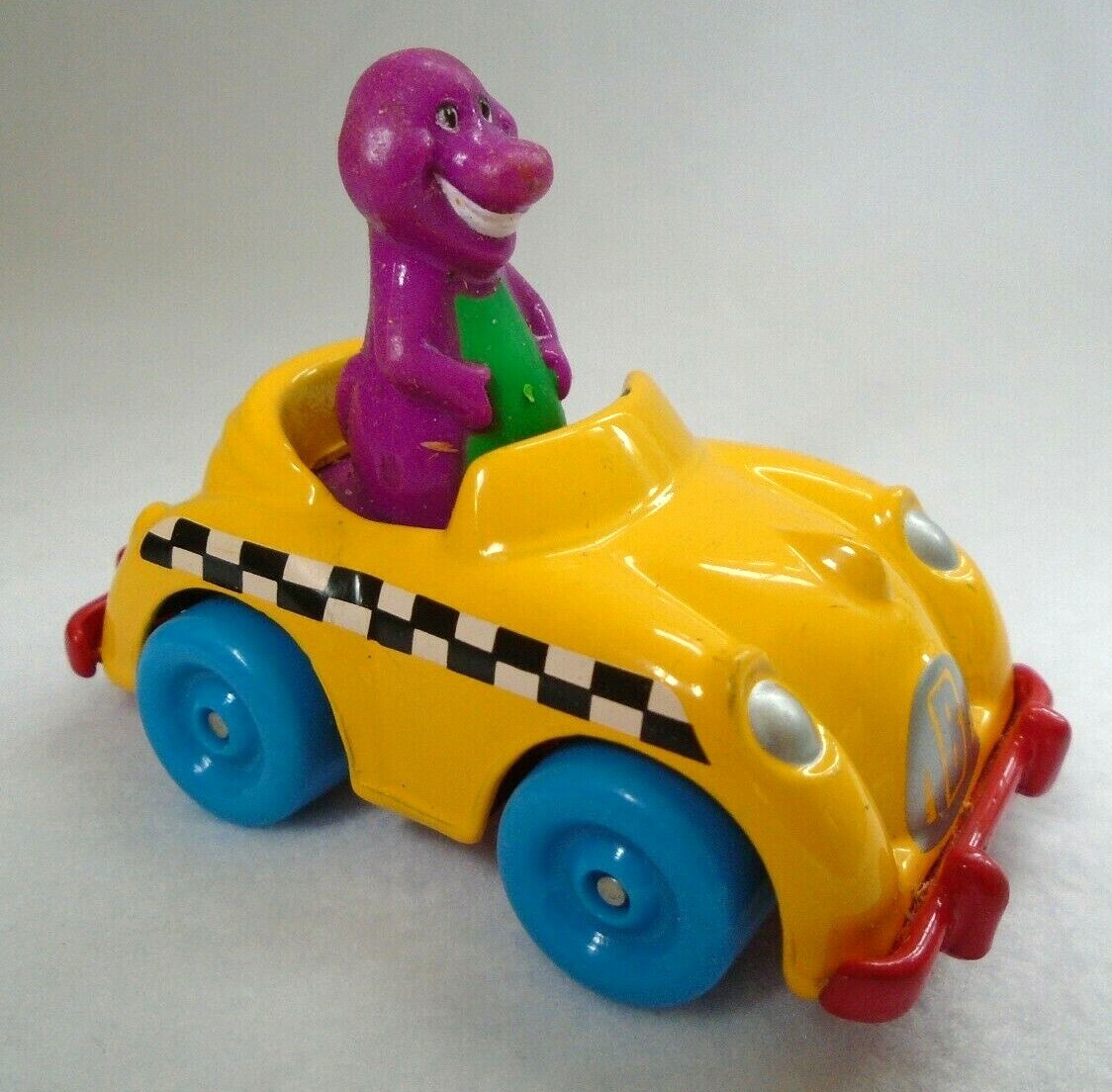 Barney The Purple Dinosaur Driving a Yellow Taxi Toy Car The Lyons ...