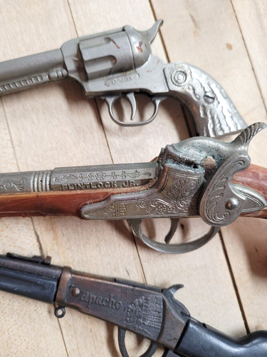 Cap Gun Collection including Cast Iron National, Daisy, Hubley etc ...