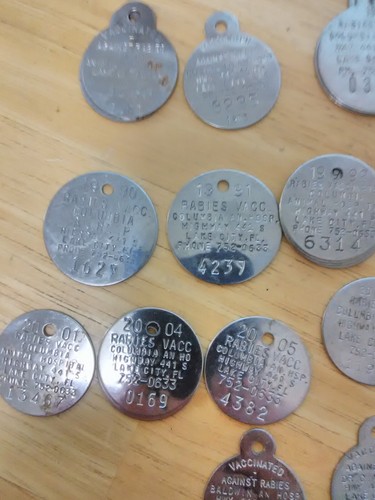 35 DOG RABIES VACCINATION TAGS /LICENSES. ALL FROM SAME OWNER 1982-2011 ...