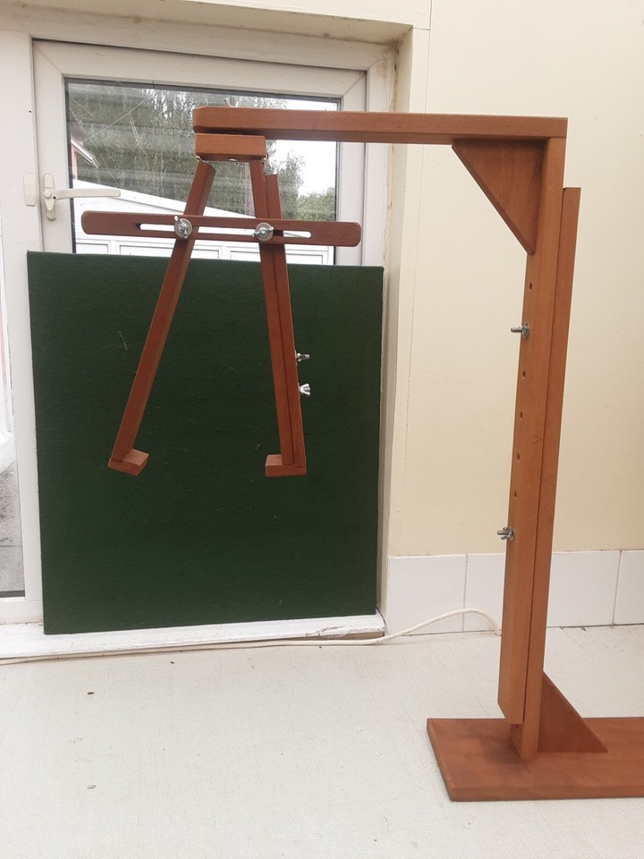 Repairers cuckoo clock stand for final adjustments testing time chimes ...