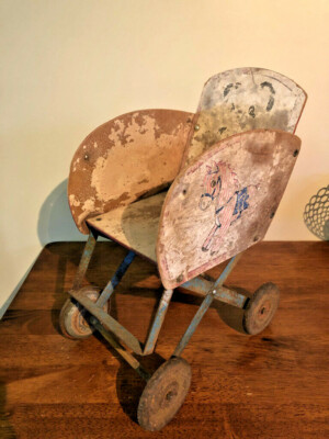 Antique toy baby carriage with old lithographs. Very old and intact ...