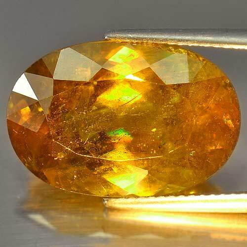 Intense Green Titanium Sphene Red Spark 15.89 Ct. Oval 19.7 x 13.4 Mm ...