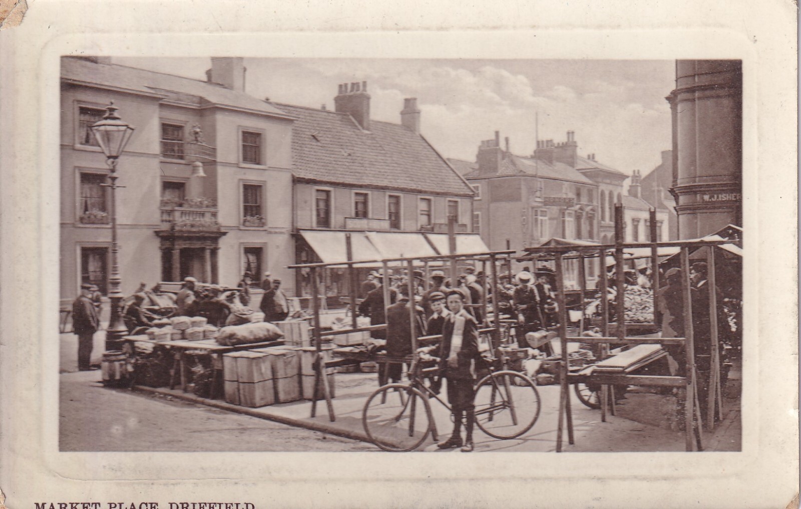 POSTCARD DRIFFIELD THE BELL HOTEL AND MARKET PLACE STALLS MIDDLE STREET ...
