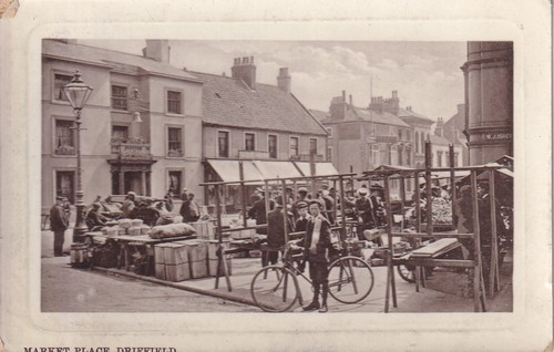 POSTCARD DRIFFIELD THE BELL HOTEL AND MARKET PLACE STALLS MIDDLE STREET ...