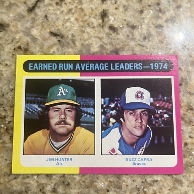 1975 Topps - League Leaders #311 Catfish Hunter, Buzz Capra | eBay