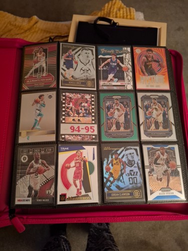a folder almost full of basketball trading cards 20 pages each with 12 ...