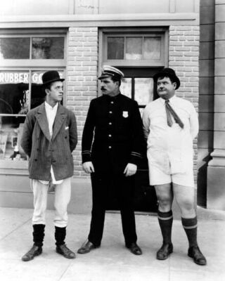 Laurel and Hardy stand without pants on next to policeman 8x10 photo | eBay
