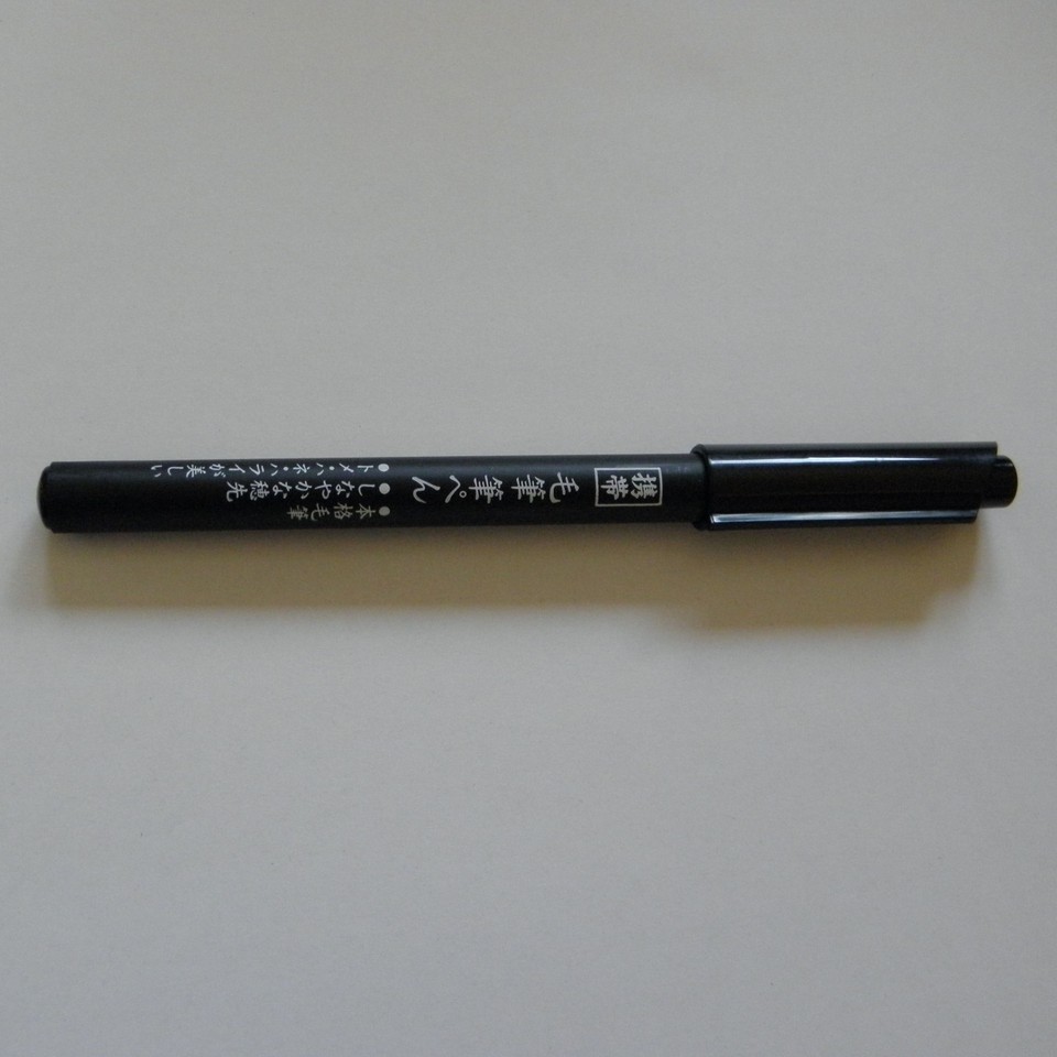 small Daruma Doll in blue color with a pen / Daruma at Takasaki : No 1 ...