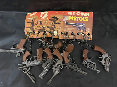 Vintage 1970's mini key chain diecast pistol cap gun lot display of 12 ...