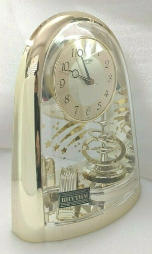 WW. RHYTHM Contemporary Motion Desk Clock Rotating Pendulum Gold Color ...