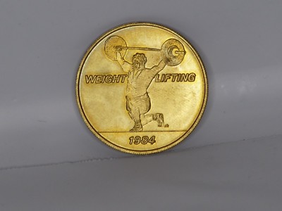 1984 Los Angeles Olympic "SCRTD" Coin - Weight Lifting | eBay