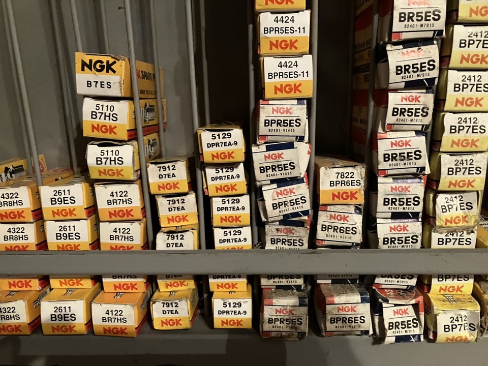 Over 140 new NGK spark plugs in display rack. | eBay UK