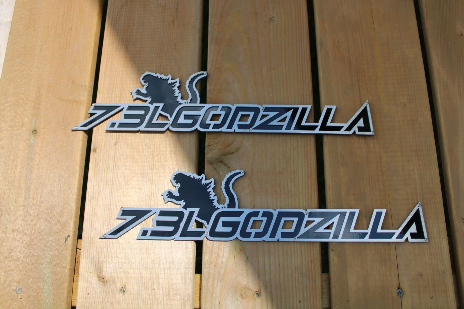7.3 Godzilla Fender Emblem - Brushed Stainless on Gloss Black | eBay
