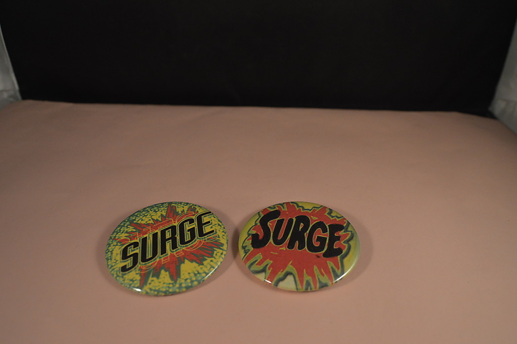 Lot of 2 "SURGE" SODA BUTTONS pins pinbacks 2 1/4" badges Large COCA ...